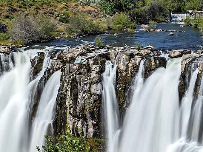 Multiple cascades create a curtain of white water that changes personality with every season and mood.