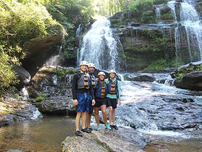 That post-rafting glow when you've conquered the river and lived to smile about it by the waterfall.