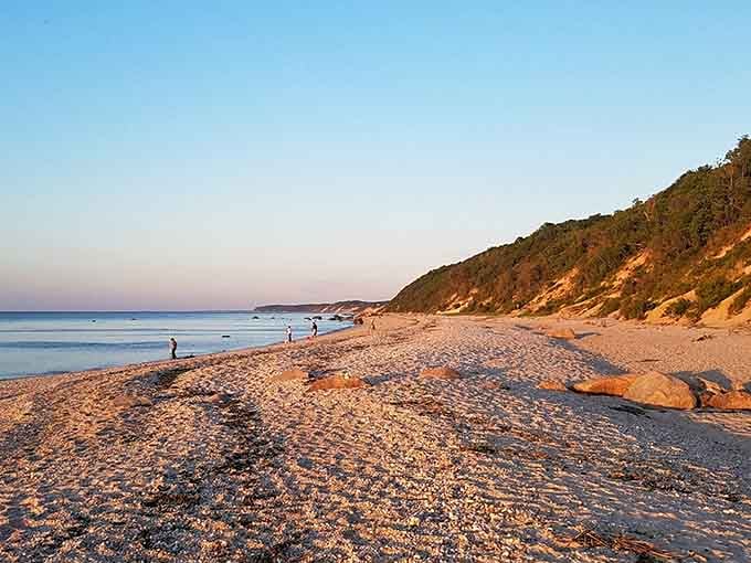 Those dramatic bluffs rising behind the beach create nature's own amphitheater for your summer vacation performance.