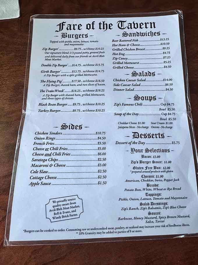The menu reads like a medieval manuscript, but the burgers are pure American comfort food glory.