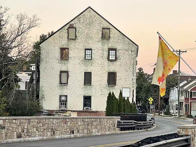 This weathered mill building has witnessed generations pass by, standing proud like a guardian of history.