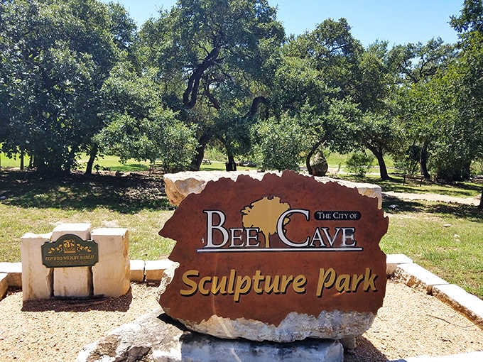 This welcoming sign carved from Hill Country stone promises art adventures beneath ancient oaks and open skies.