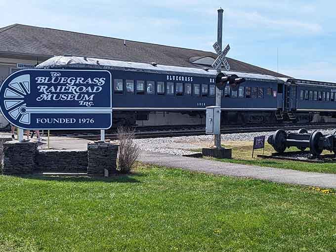 The museum's welcoming sign and vintage blue railcar create a picture-perfect invitation to step back in time.