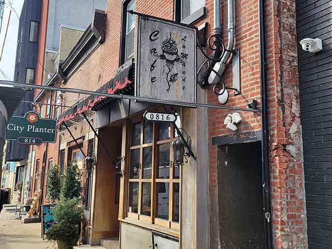 That weathered brick and artistic signage whisper "urban breakfast sanctuary" louder than any billboard ever could.