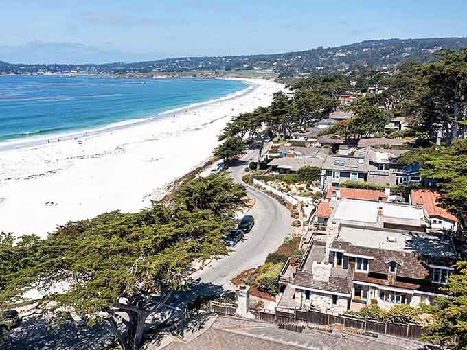 Carmel's pristine coastline curves like nature's own masterpiece, where cypress trees meet endless white sand and crashing waves.