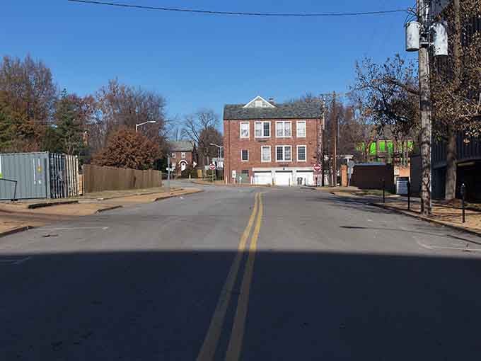 This quiet intersection whispers stories of simpler times when neighbors knew each other's coffee orders by heart.