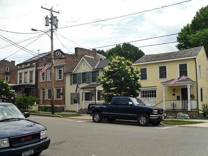 Flags flying proud on residential streets where neighbors still wave and remember when you could leave doors unlocked.