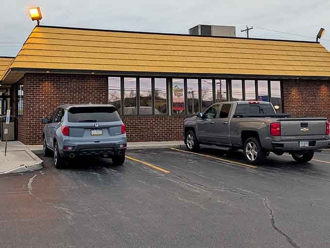 That distinctive yellow roof and brick exterior signal you've arrived at a place where hot weiners are serious business.