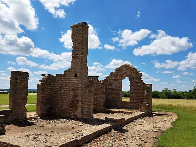 These crumbling brick walls standing against endless prairie sky tell powerful stories without saying a single word.