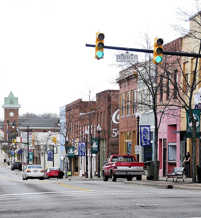 Main Street charm meets practical living where traffic lights still hang on wires and neighbors wave from passing cars.