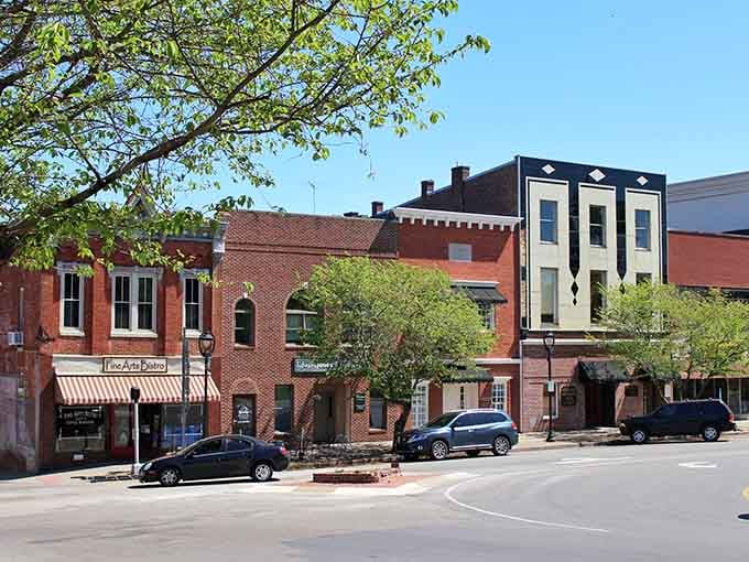 Spring trees frame this charming downtown corner where local shops still outnumber the chain stores, thankfully.