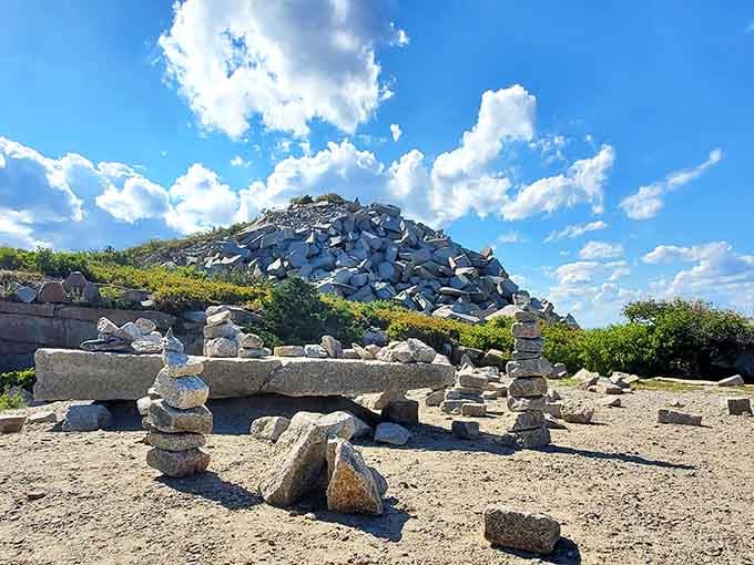 Stacked stones create a whimsical sculpture garden where visitors leave their mark on this coastal canvas of granite.