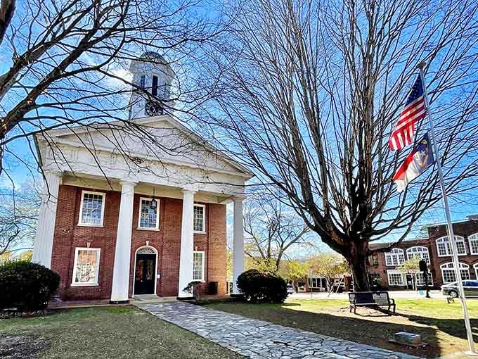 White columns and brick walls under blue skies create a scene straight from a beloved classic film.