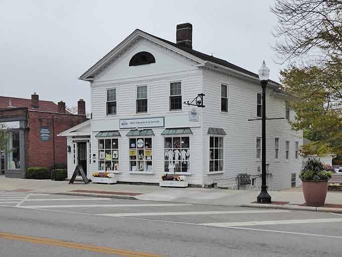 This crisp white building houses local charm behind those welcoming windows, inviting you to step inside history.
