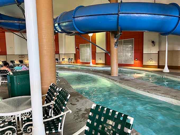 Those poolside chairs are calling your name after you've conquered the blue slide twisting overhead like a pretzel.
