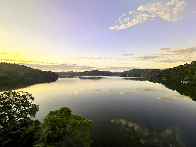 Dawn breaks over glassy waters, painting the sky in buttery yellows that would make any artist jealous.