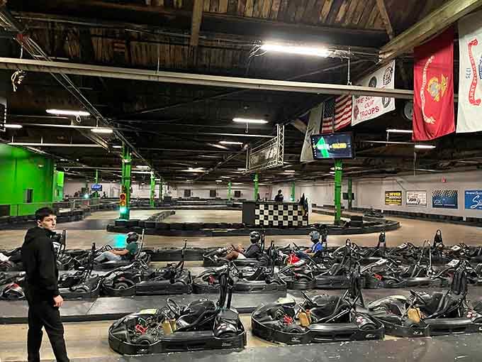 Rows of karts wait patiently like eager students before recess, ready to unleash controlled chaos on the track ahead.