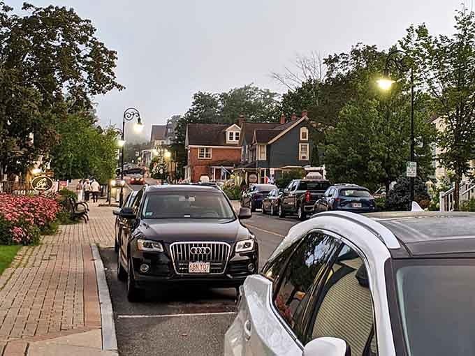 Evening descends on this charming street where brick sidewalks and twinkling lights create an irresistible small-town atmosphere.