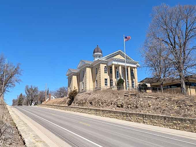 The Dodge County Courthouse crowns its limestone hill like a proud old general who has absolutely nothing left to prove.