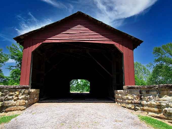 Those stone abutments anchoring this crimson beauty prove they built things to last back in the day.