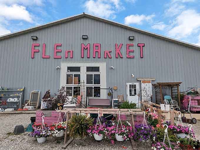 Pink lettering on gray metal creates curb appeal that says "come find something wonderful" louder than any billboard could.