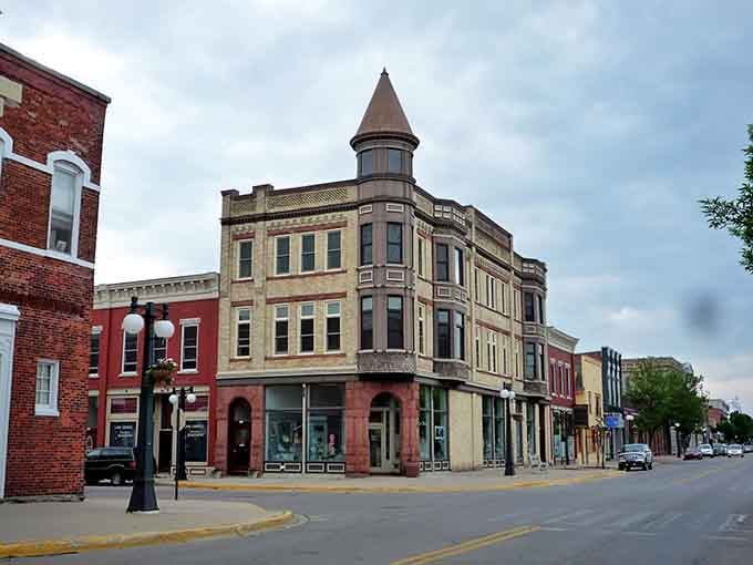That distinctive turret building anchors Menominee's downtown like a Victorian-era lighthouse guiding you to affordable waterfront living.