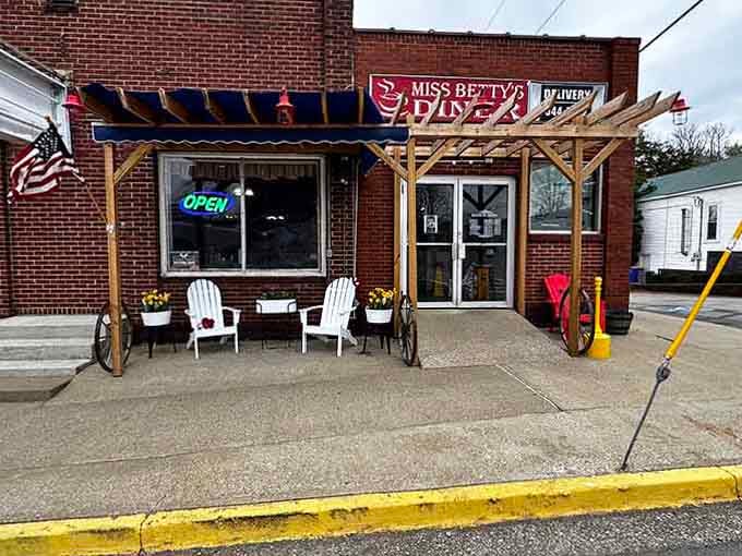 Charming brick facade with Adirondack chairs creates the perfect spot for lingering over coffee and conversation.