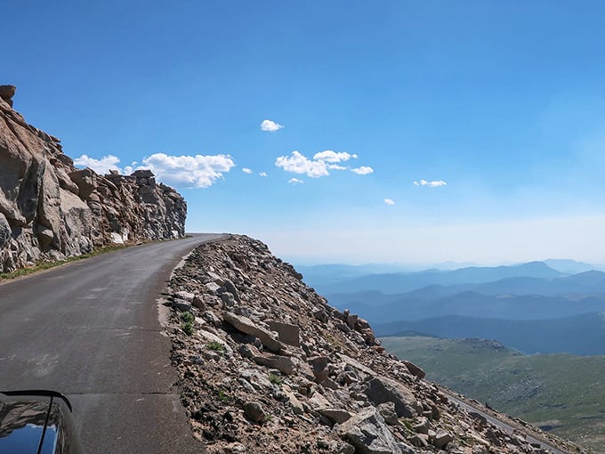 This winding mountain road hugs cliffs so dramatic that even your GPS might get a little nervous about the journey.