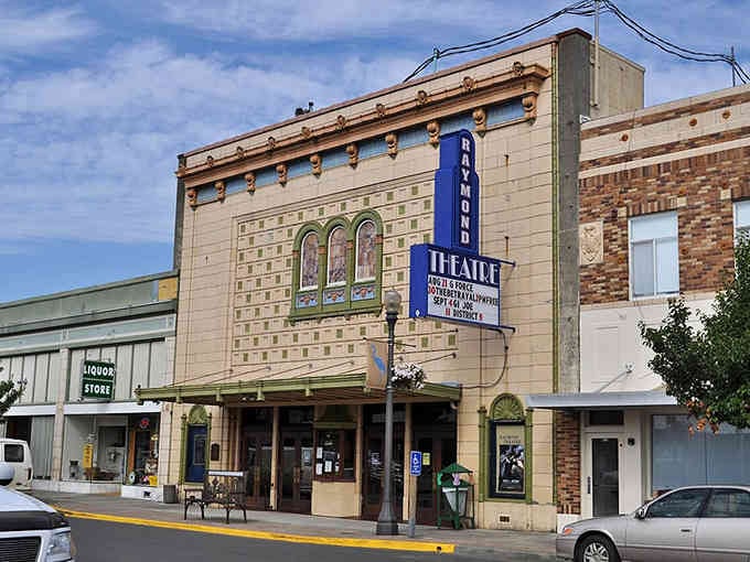 The historic Raymond Theatre stands as a beautiful reminder that entertainment once meant gathering together, not scrolling alone.
