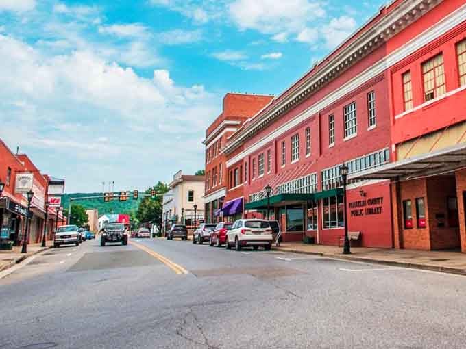 Stroll down this vibrant red brick street in Rocky Mount, where local shops and a cozy library create a welcoming atmosphere.