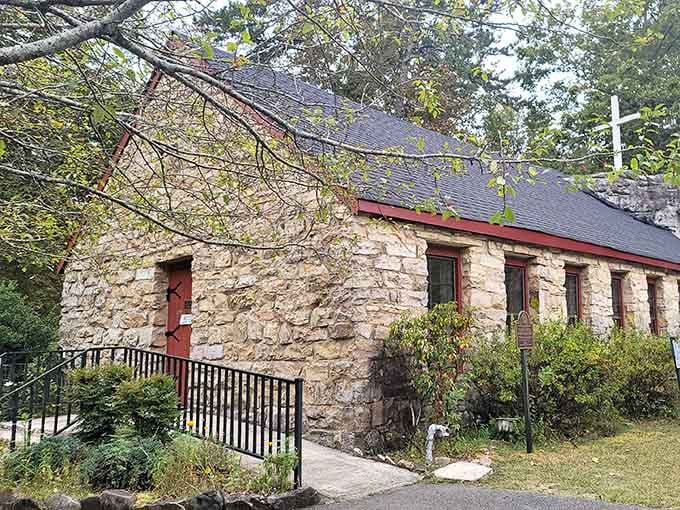 Rough-hewn stone walls meet simple wooden pews in this remarkable church built right into the mountainside's natural rock face.