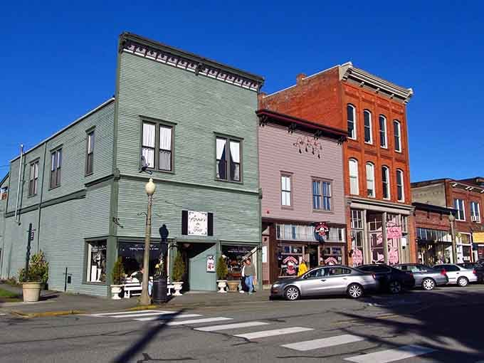 Painted storefronts in cheerful colors line up like a rainbow, proving small towns know how to brighten your day.
