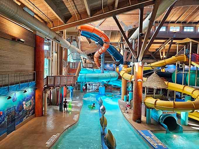 Wooden beams frame this cozy water kingdom where slides spiral down like ribbons on a present.