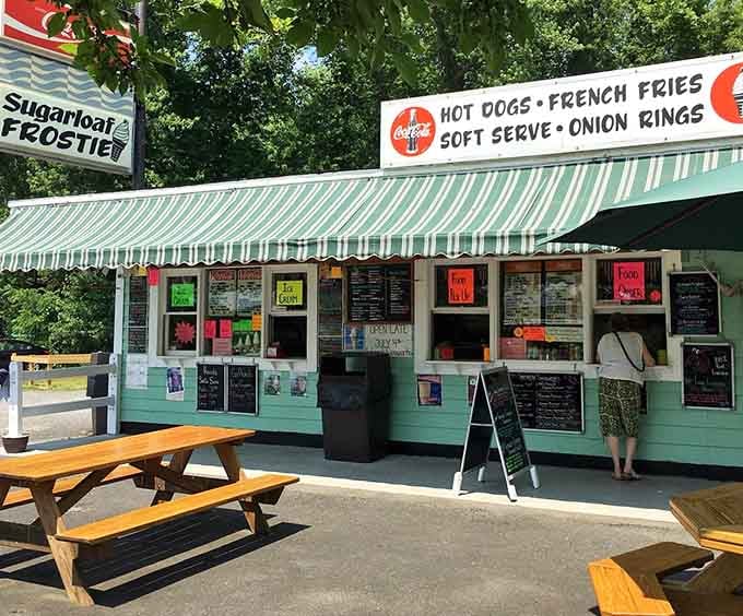 Summer perfection captured in mint green and white stripes - like a Norman Rockwell painting with soft-serve ice cream.