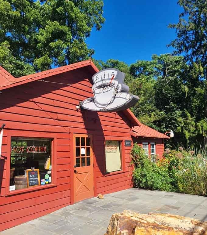 That oversized coffee cup sign perched on the red roof is like a beacon for caffeine seekers.