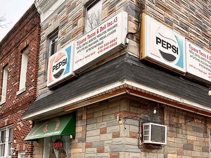 Those vintage Pepsi signs tell you this corner spot has been feeding the neighborhood longer than most restaurants survive.