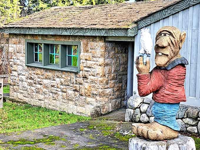 This troll's casual lean against the stone cottage suggests he's been waiting here for his coffee break since yesterday.