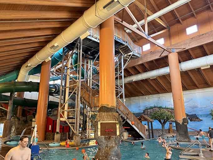 Wild Woods serves up a bird's-eye view of summer perfection, with graceful purple slide tubes curling toward that brilliant blue pool below.