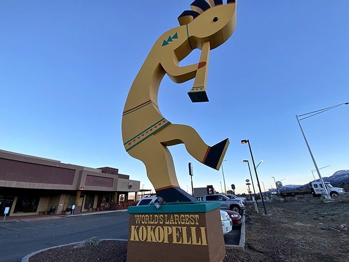 Standing tall at sunset, this flute player celebrates ancient traditions in a decidedly modern, supersized way that stops traffic.