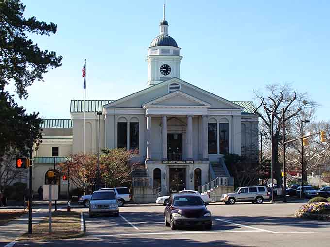 That elegant courthouse dome gleams white against blue skies, a beacon of small-town pride and architectural beauty.
