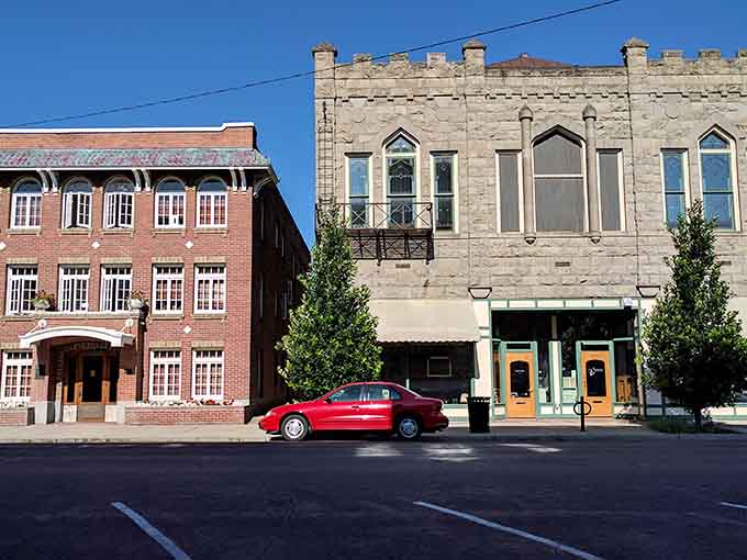 Historic facades line streets where classic cars fit right in and parking spots are actually findable without divine intervention.