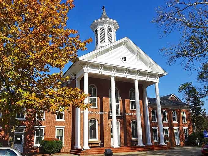 That courthouse with its grand white columns has seen generations pass, each one moving just a little bit slower.