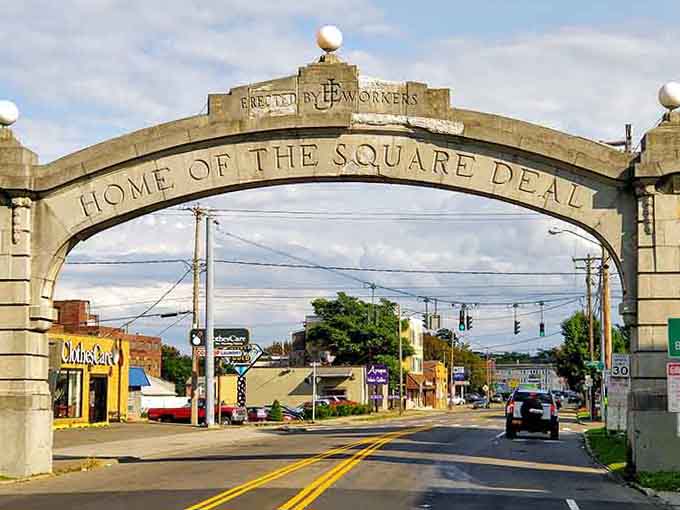 The "Home of the Square Deal" arch welcomes visitors with a promise of fairness that still defines this community today.