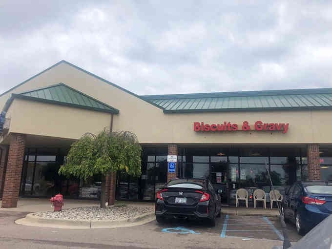 The covered entrance and tidy landscaping suggest a place where details matter, from decor to delicious food.