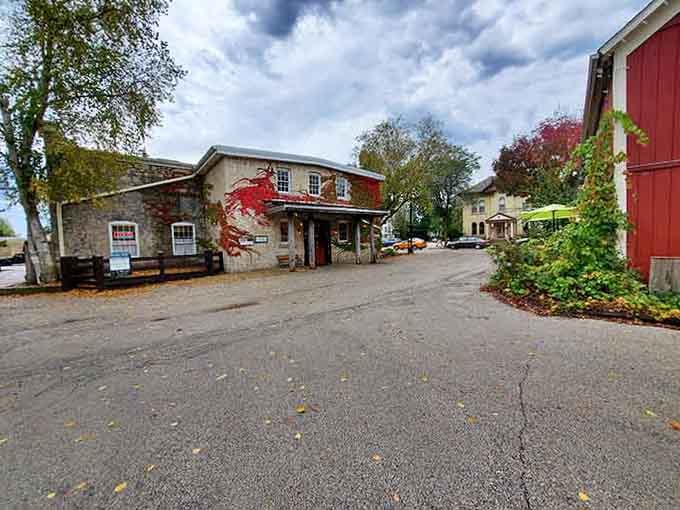 Cedarburg's historic settlement buildings nestle among autumn trees like a scene from your favorite cozy mystery novel come to life.
