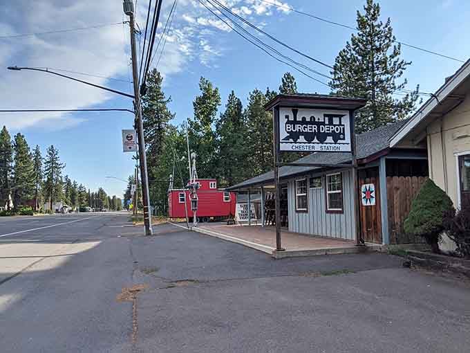 The Burger Depot sign beckons travelers along this quiet mountain road where towering pines outnumber the buildings by thousands.