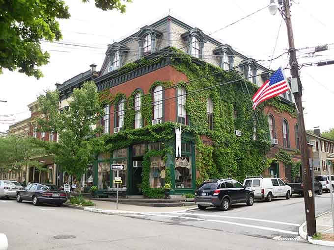 That corner building draped in green proves nature and architecture make the best partnership when given enough time.