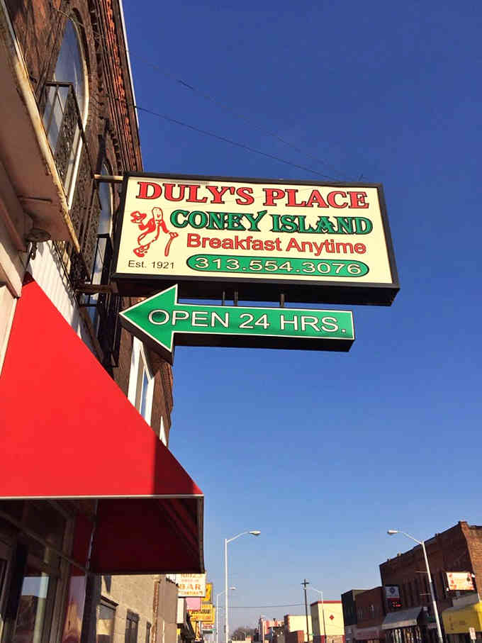 That glowing sign against the evening sky feels like a lighthouse guiding night owls to their coney dog salvation.