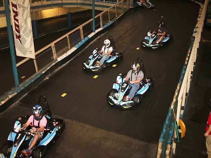 Racing indoors with friends beats any board game night, especially when you're chasing lap records around banked turns.