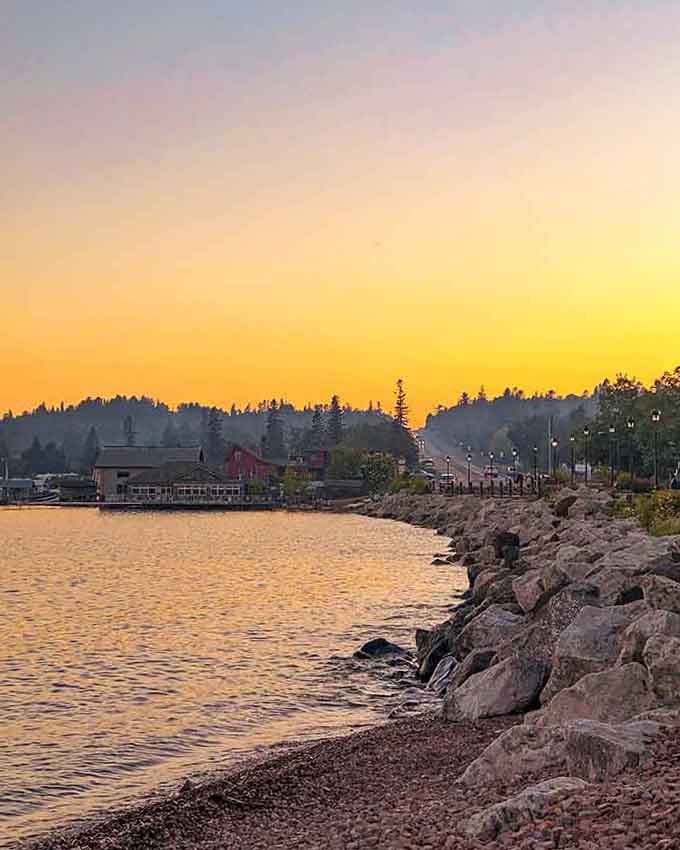 Golden hour transforms the harbor into liquid fire, proving nature still puts on the best show in town every single evening.
